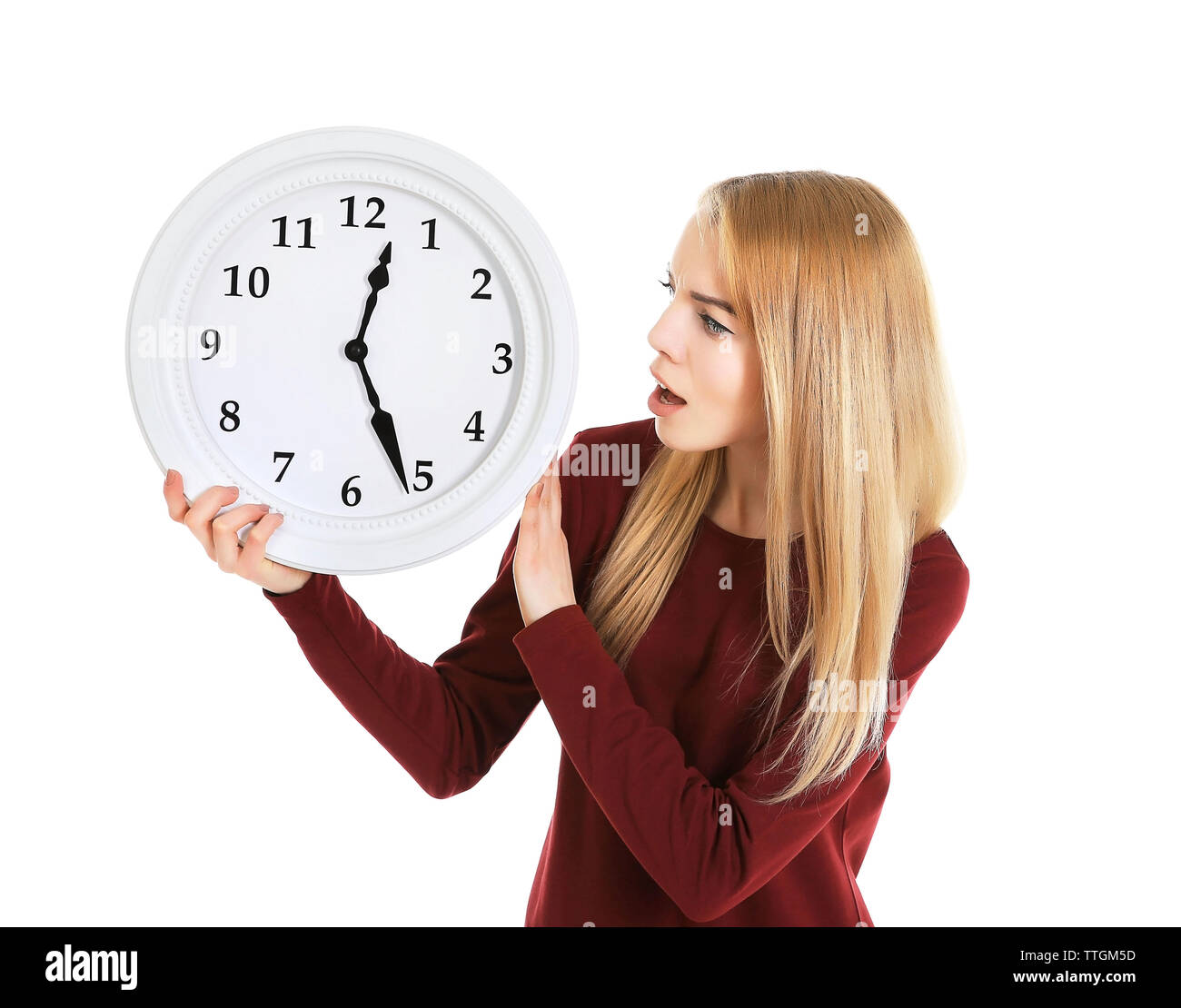 Beautiful young girl holding clock, isolated on white Stock Photo - Alamy