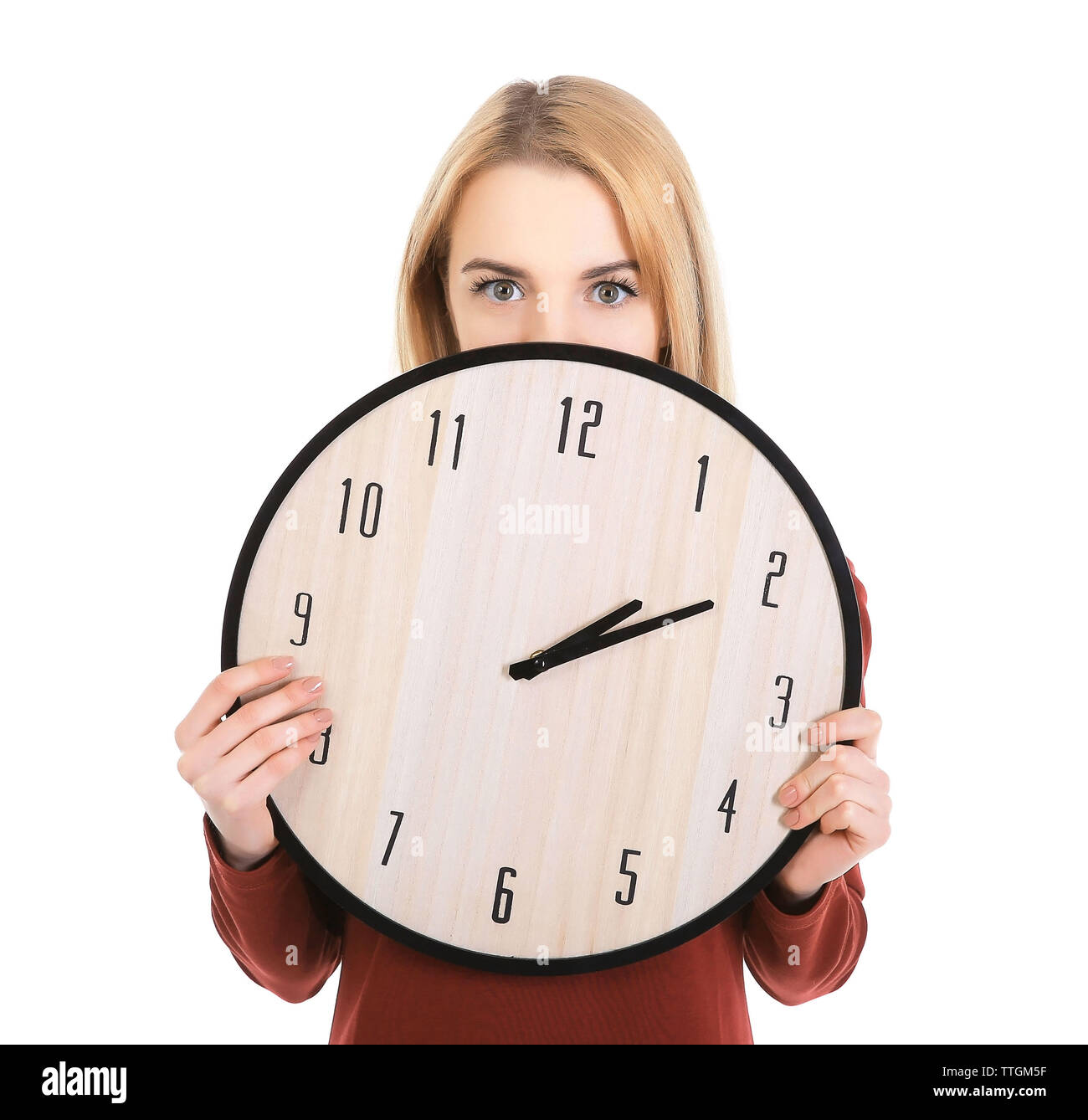Beautiful young girl holding clock, isolated on white Stock Photo - Alamy