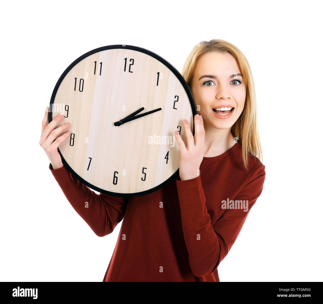 Beautiful young girl holding clock, isolated on white Stock Photo - Alamy