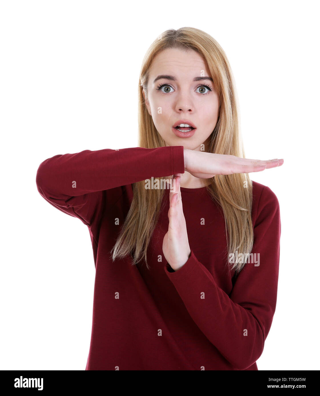 Young beautiful girl shows timeout, isolated on white Stock Photo - Alamy
