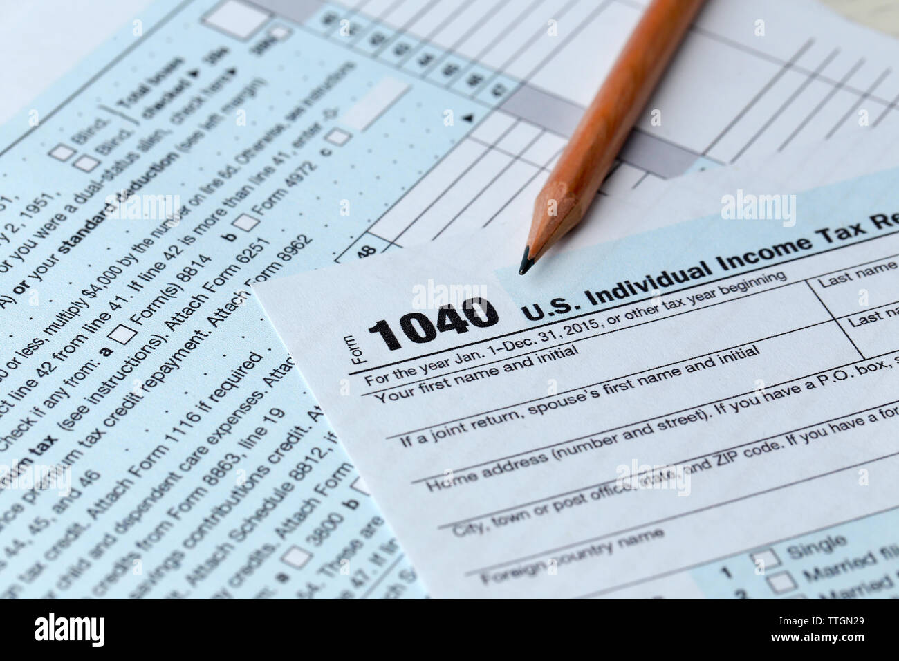 1040 Individual Income Tax Return Form for 2015 year with a pencil to ...
