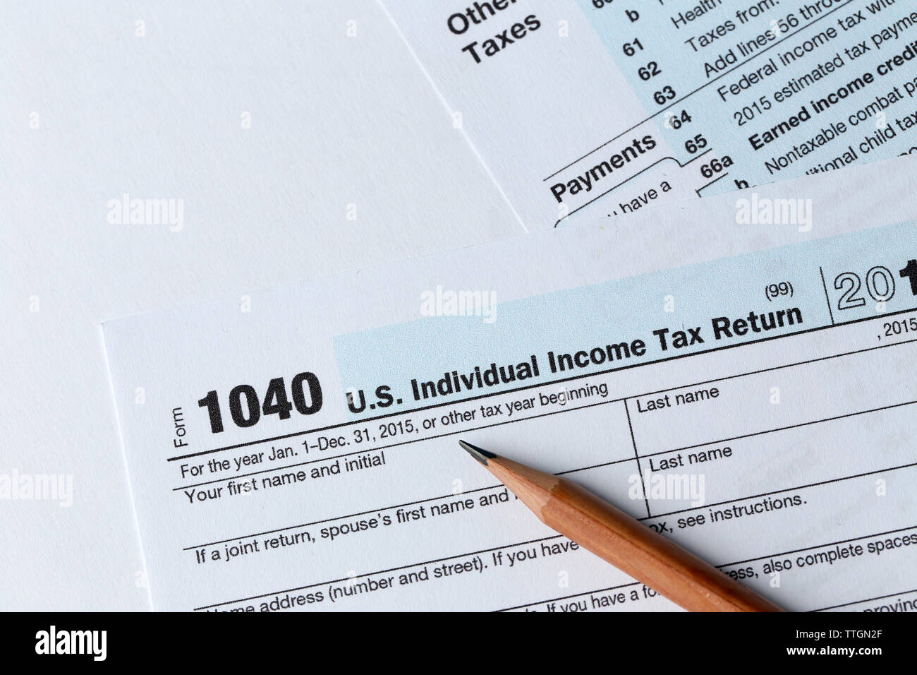 1040 Individual Income Tax Return Form for 2015 year with a pencil to ...