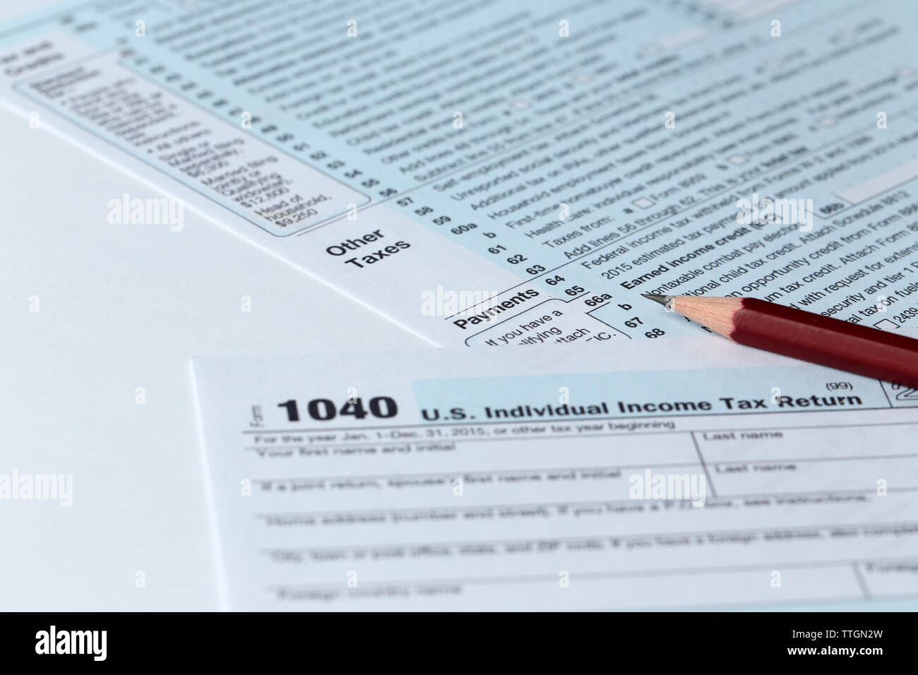 1040 Individual Income Tax Return Form for 2015 year with a pencil to ...