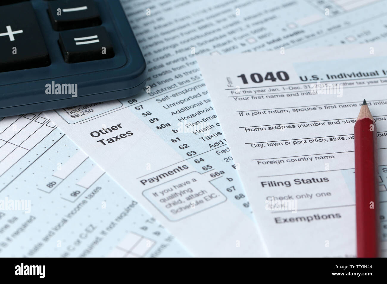 1040 Individual Income Tax Return Form for 2015 year with a pencil to ...