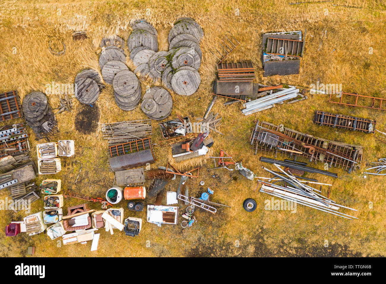 Different garbage on field Stock Photo - Alamy