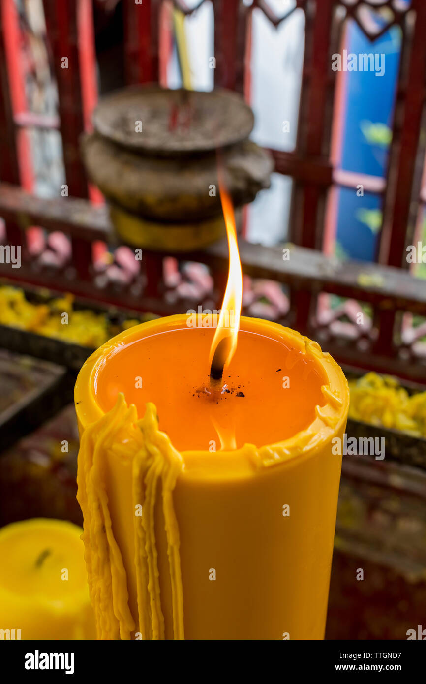 Candle in a temple in Thailand Stock Photo - Alamy