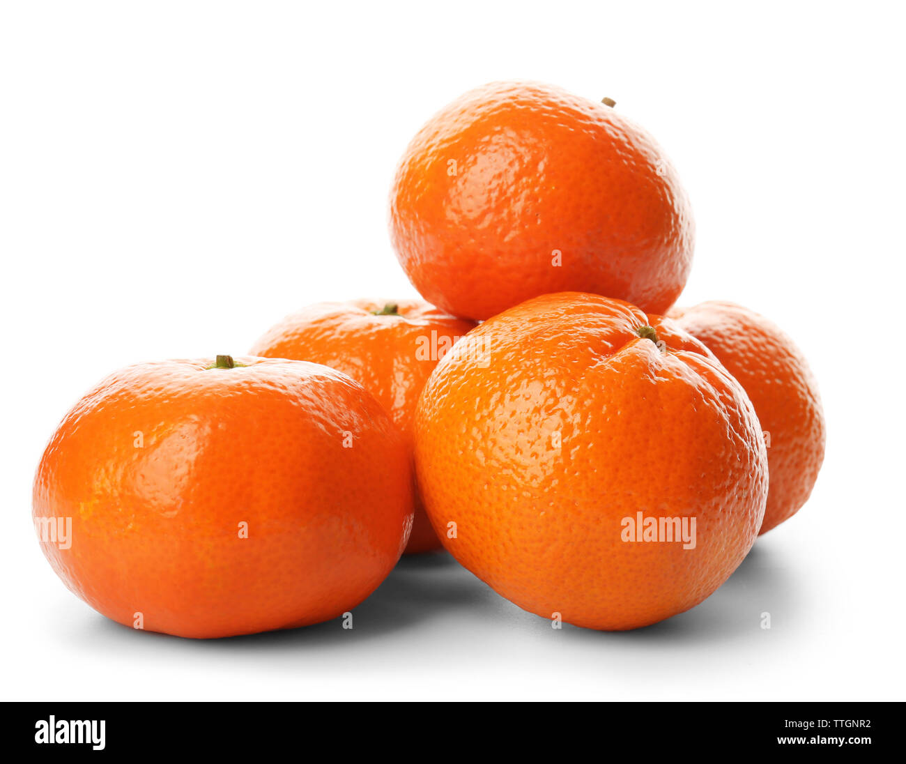 A pile of fresh tangerines isolated on white background, close up Stock ...