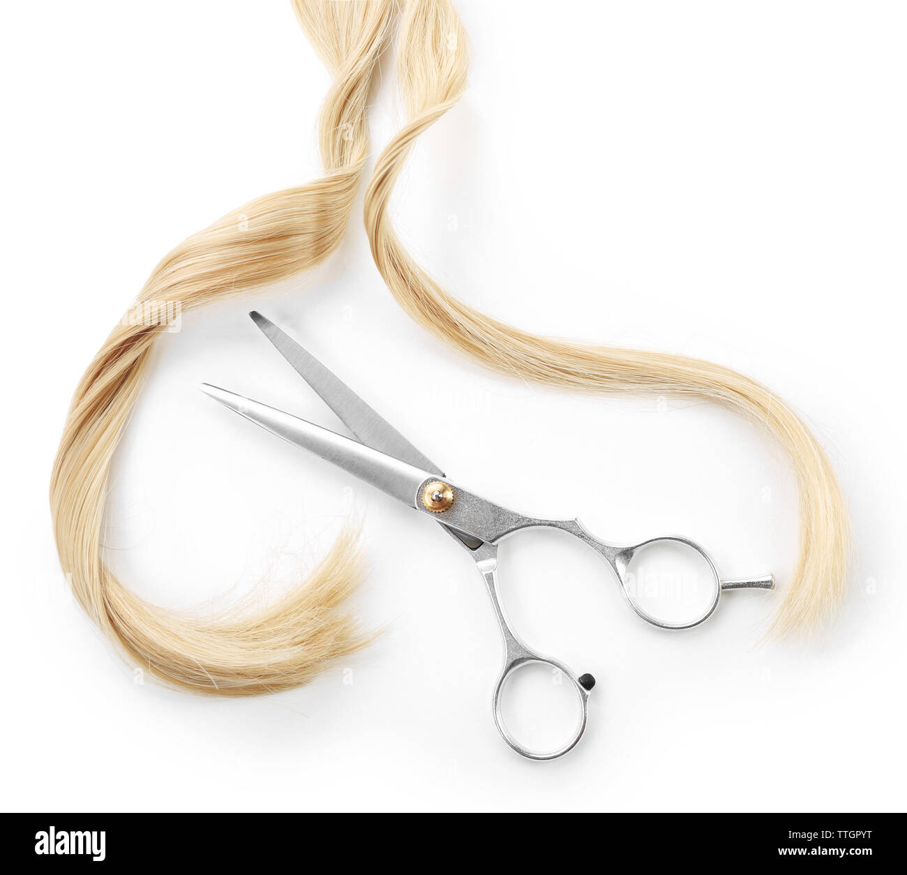 Hairdresser's scissors with strand of blonde hair, isolated on white ...