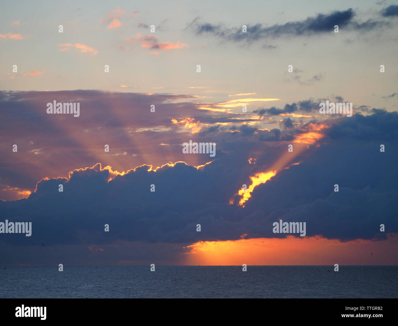 The majesty of sunlight sky Crepuscular rays shining through storm ...