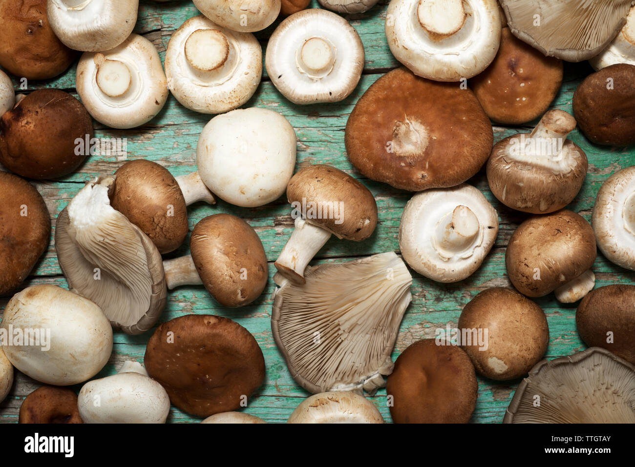 Mushrooms on a wood table Stock Photo - Alamy