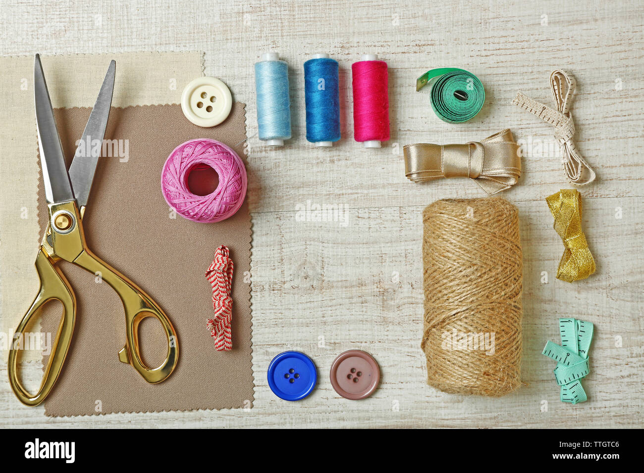 Sewing creative accessories on wooden table, top view Stock Photo - Alamy