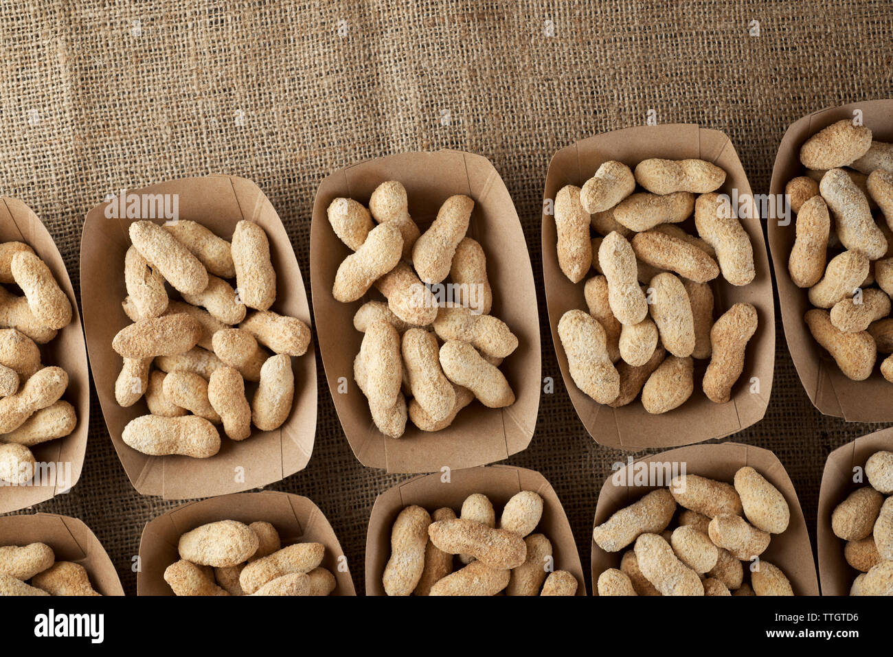 Peanuts with shell in disposable cardboard boxes Stock Photo - Alamy