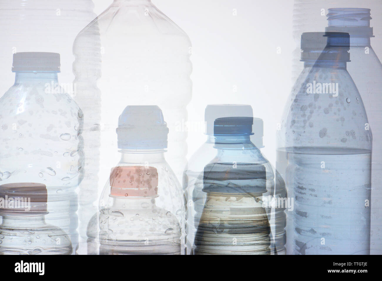Used water bottles and white background Stock Photo - Alamy