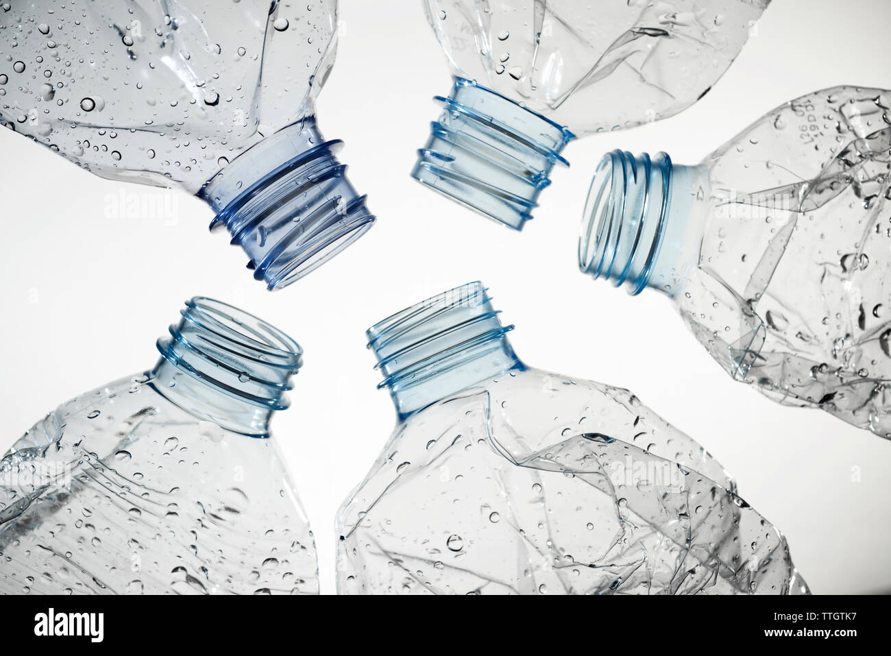 Used water bottles and white background Stock Photo - Alamy