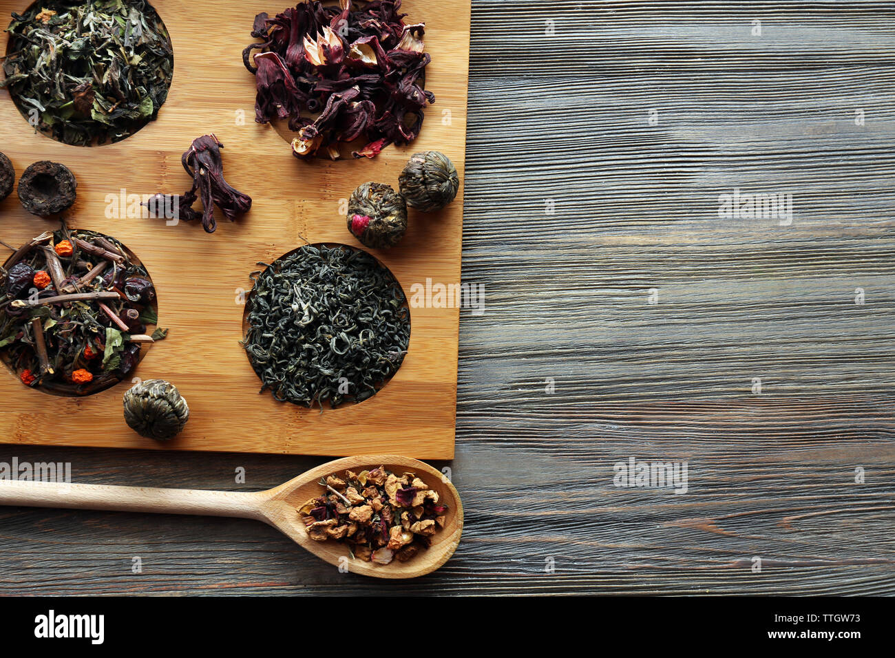 Tea concept. Different kinds of tea on wooden background Stock Photo ...