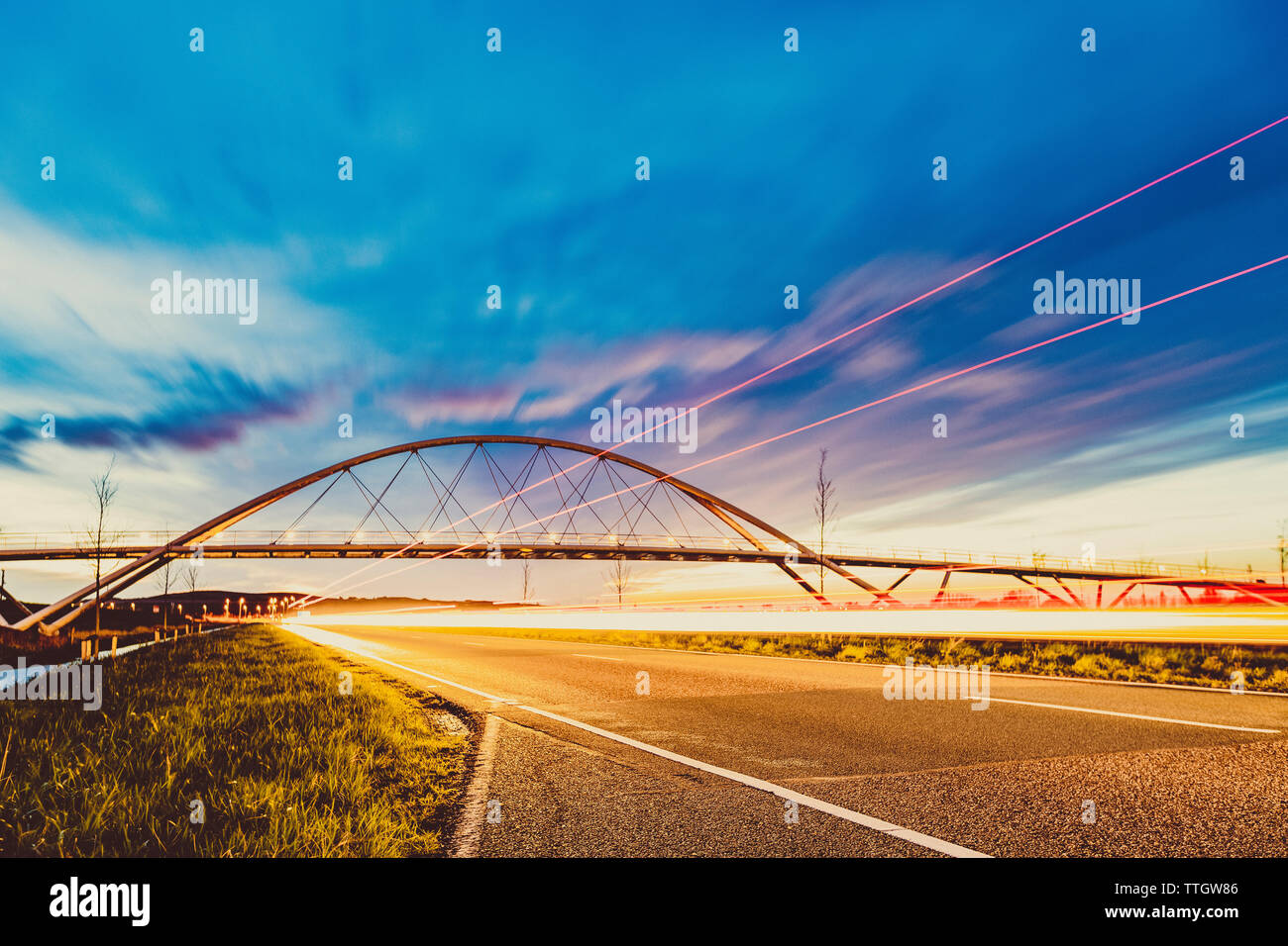 Footbridge over the road in North Holland at night Stock Photo - Alamy