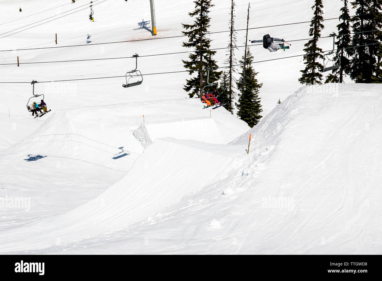 A man hits a jump on skis in the terrain park at Whistler Blackcomb ...
