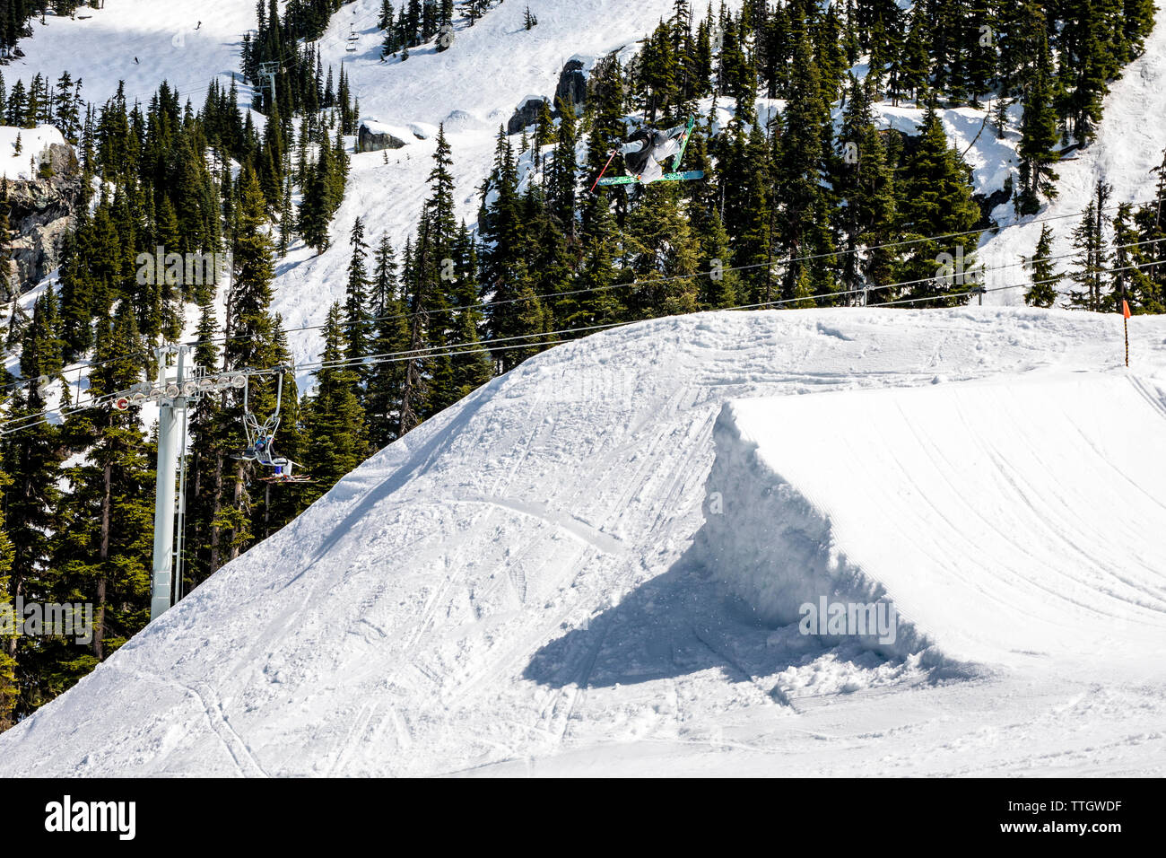 A man hits a jump on skis in the terrain park at Whistler Blackcomb ...
