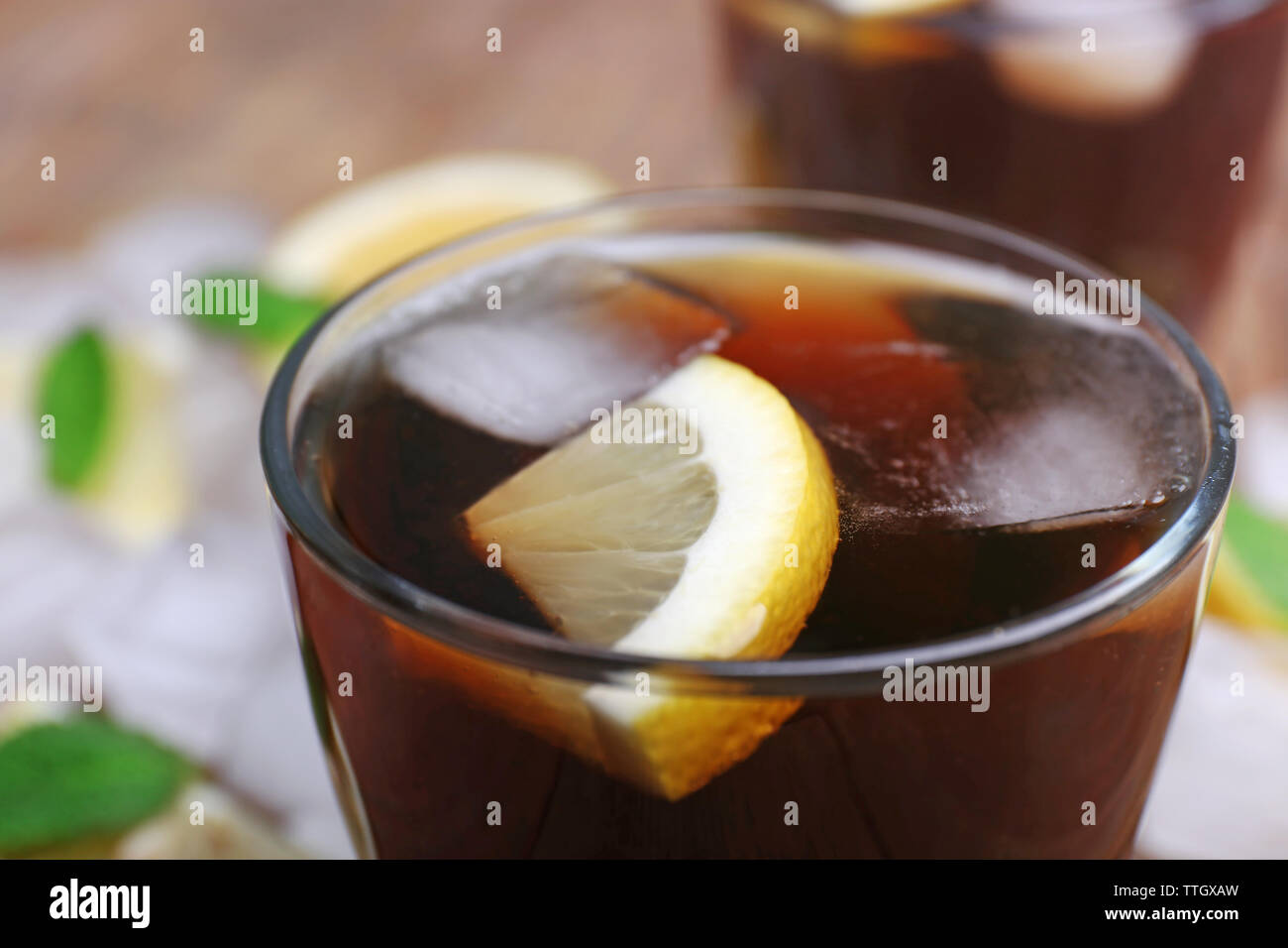 Glass of cola with cubes of ice and lemon, closeup Stock Photo - Alamy