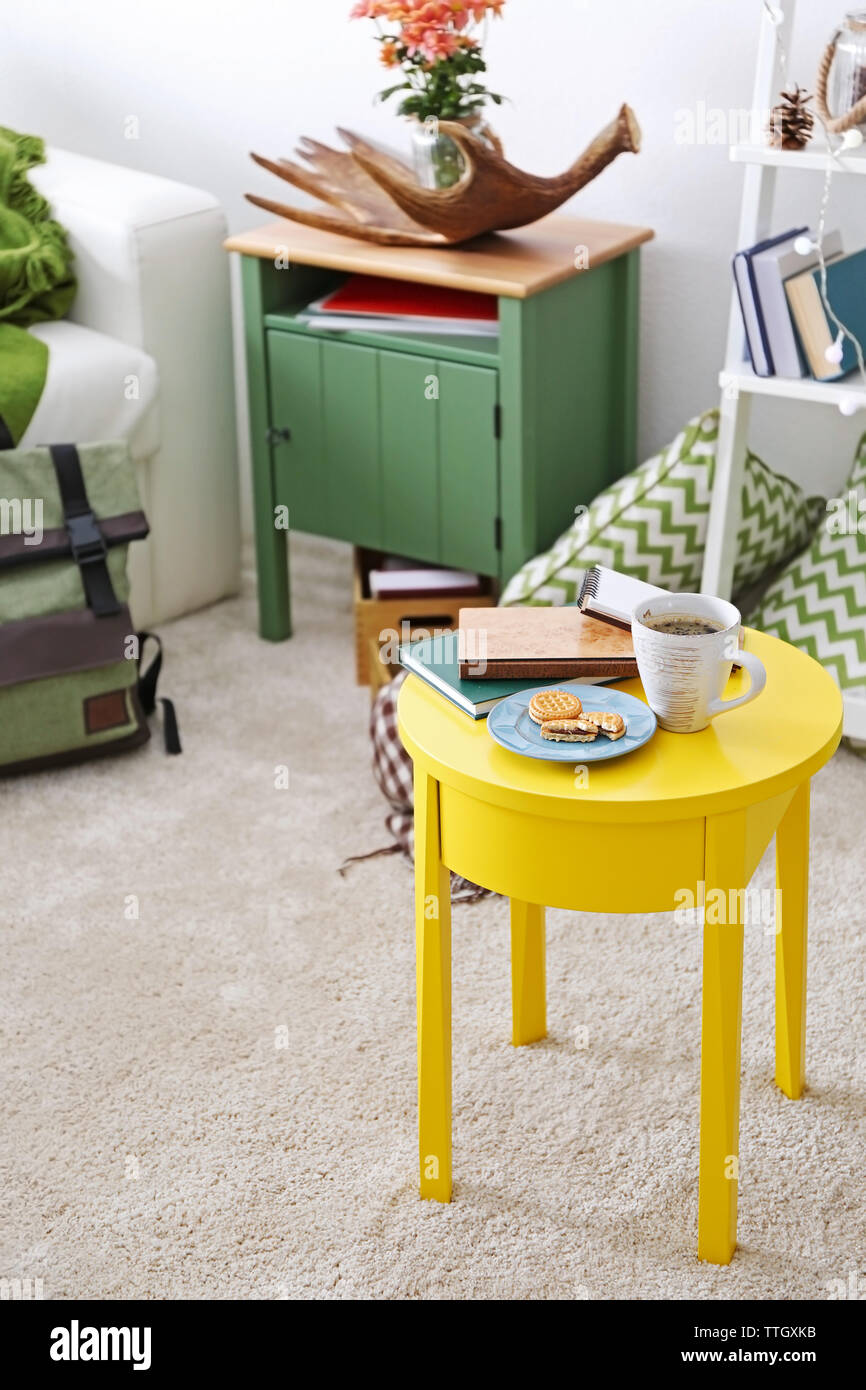 Interior of living room with yellow table Stock Photo - Alamy