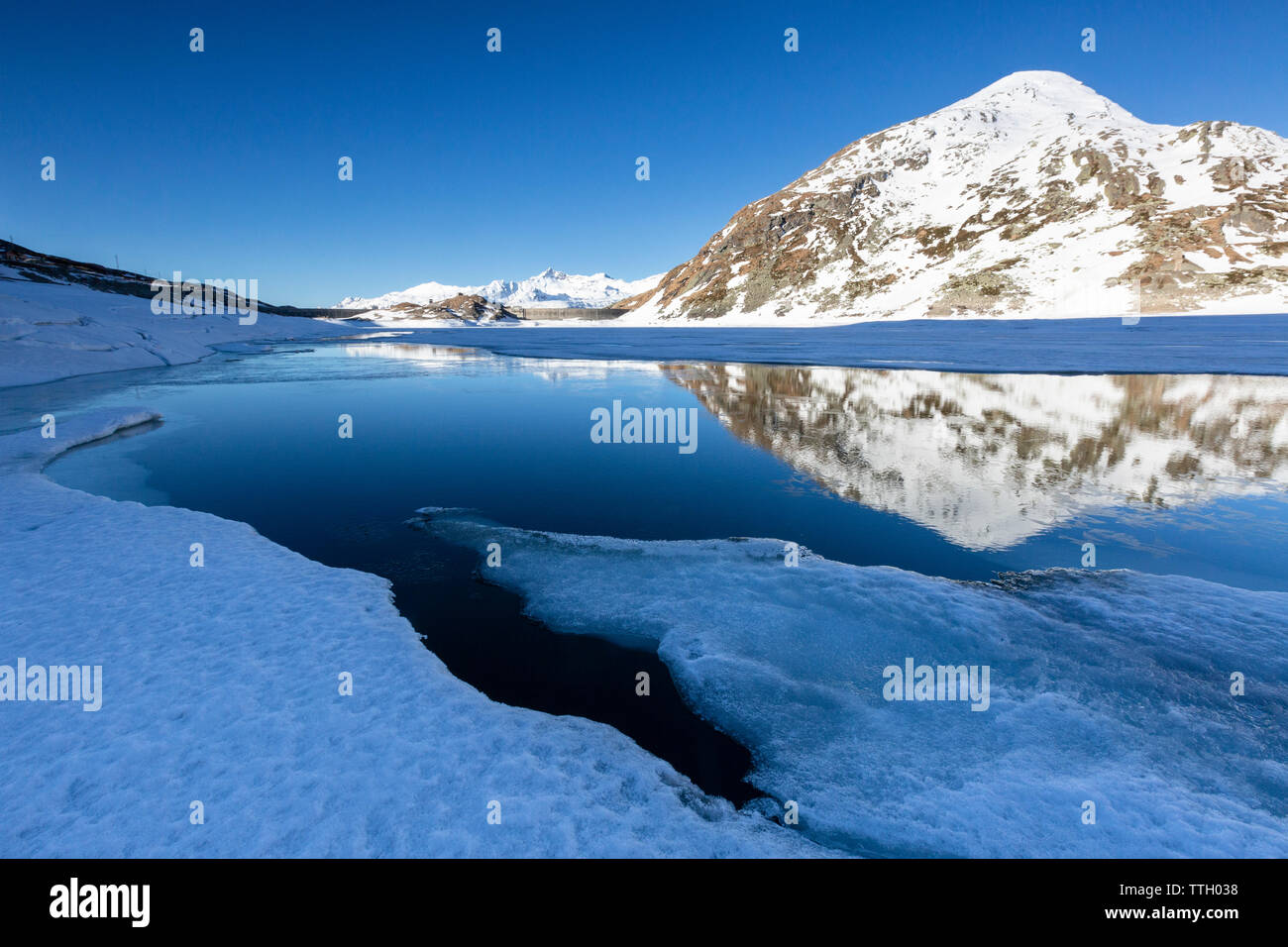 Lake Montespluga during spring thaw, Valtellina, Italy Stock Photo - Alamy