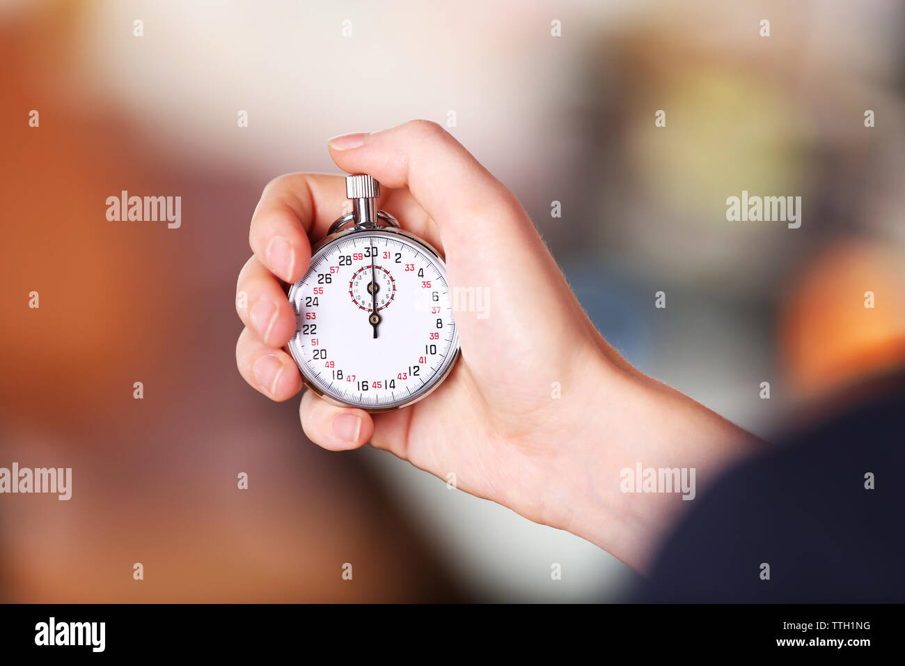 Woman with stopwatch hi-res stock photography and images - Alamy