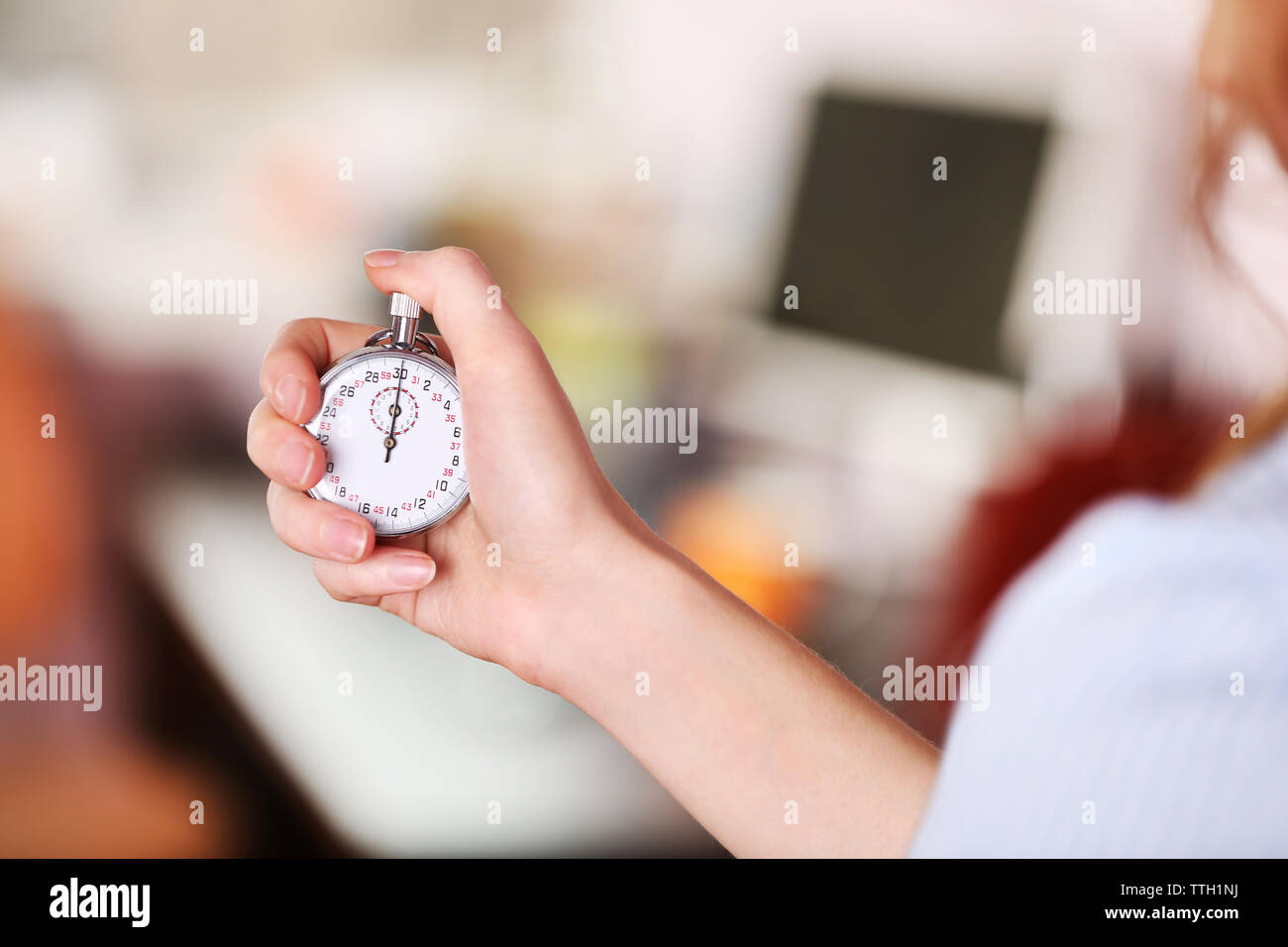 Woman holds stopwatch in hand, close up Stock Photo - Alamy