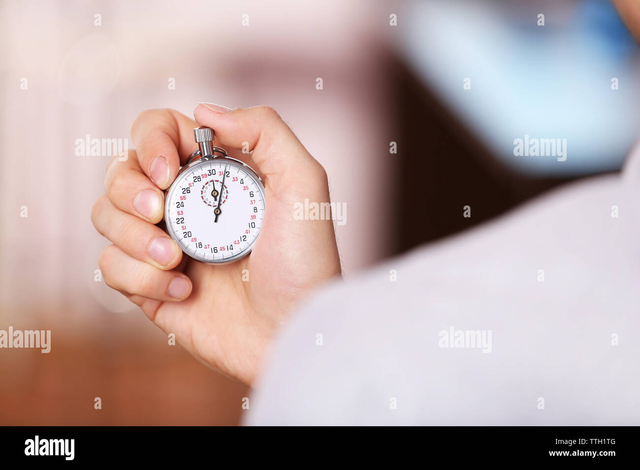 Man holds stopwatch in hand, close up Stock Photo - Alamy
