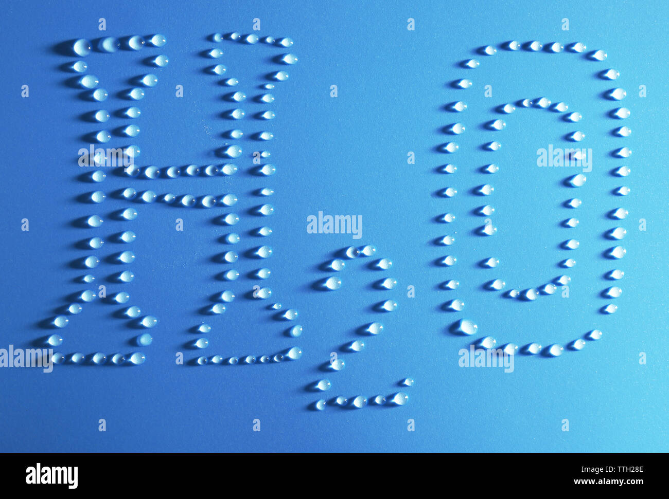Water formula made of drops on blue background Stock Photo - Alamy