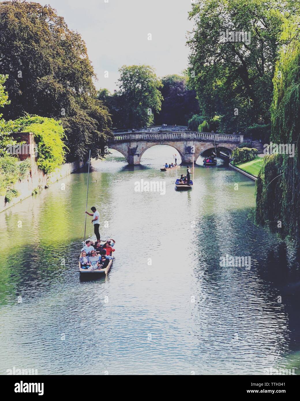 Boats on the river passing trough a bridge Stock Photo - Alamy