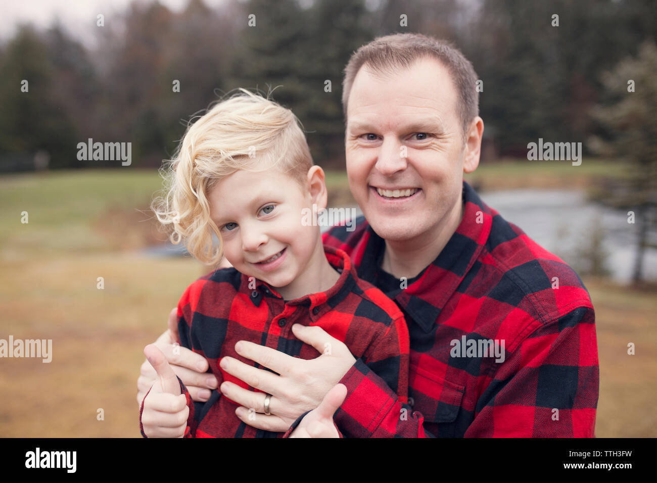 Family in Matching Red Plaid Stock Photo - Alamy