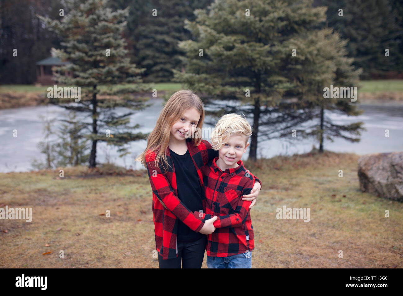 Family in Matching Red Plaid Stock Photo - Alamy
