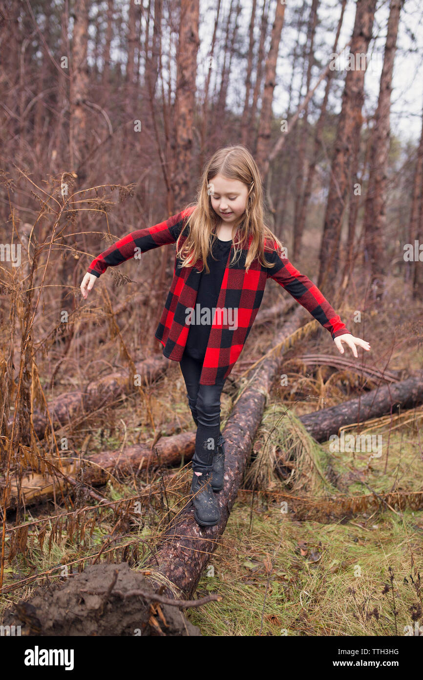 Girl Walking on a Log Stock Photo - Alamy