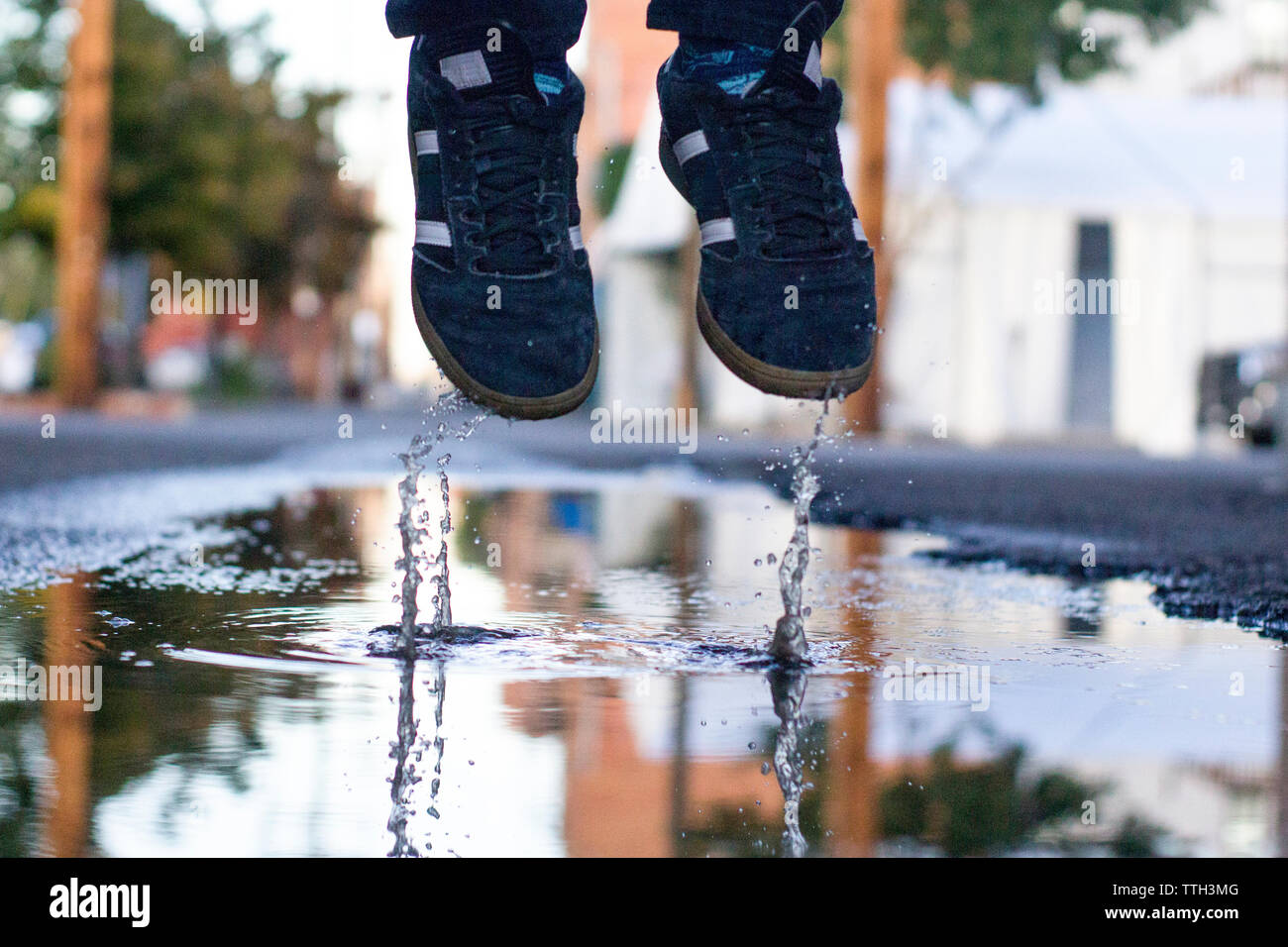 Man jumping in puddle hi-res stock photography and images - Alamy