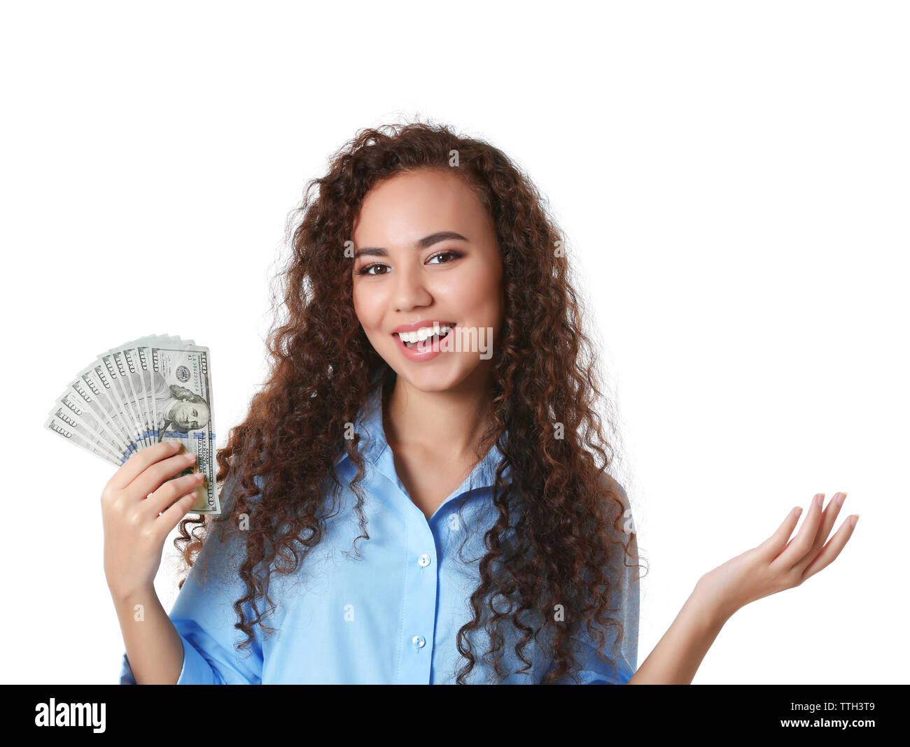 Beautiful young girl holding cash, isolated on white Stock Photo - Alamy