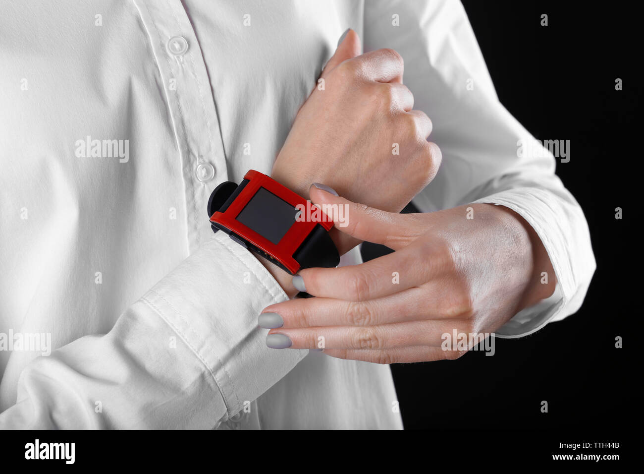 Modern watch on a woman's wrist, close up Stock Photo - Alamy