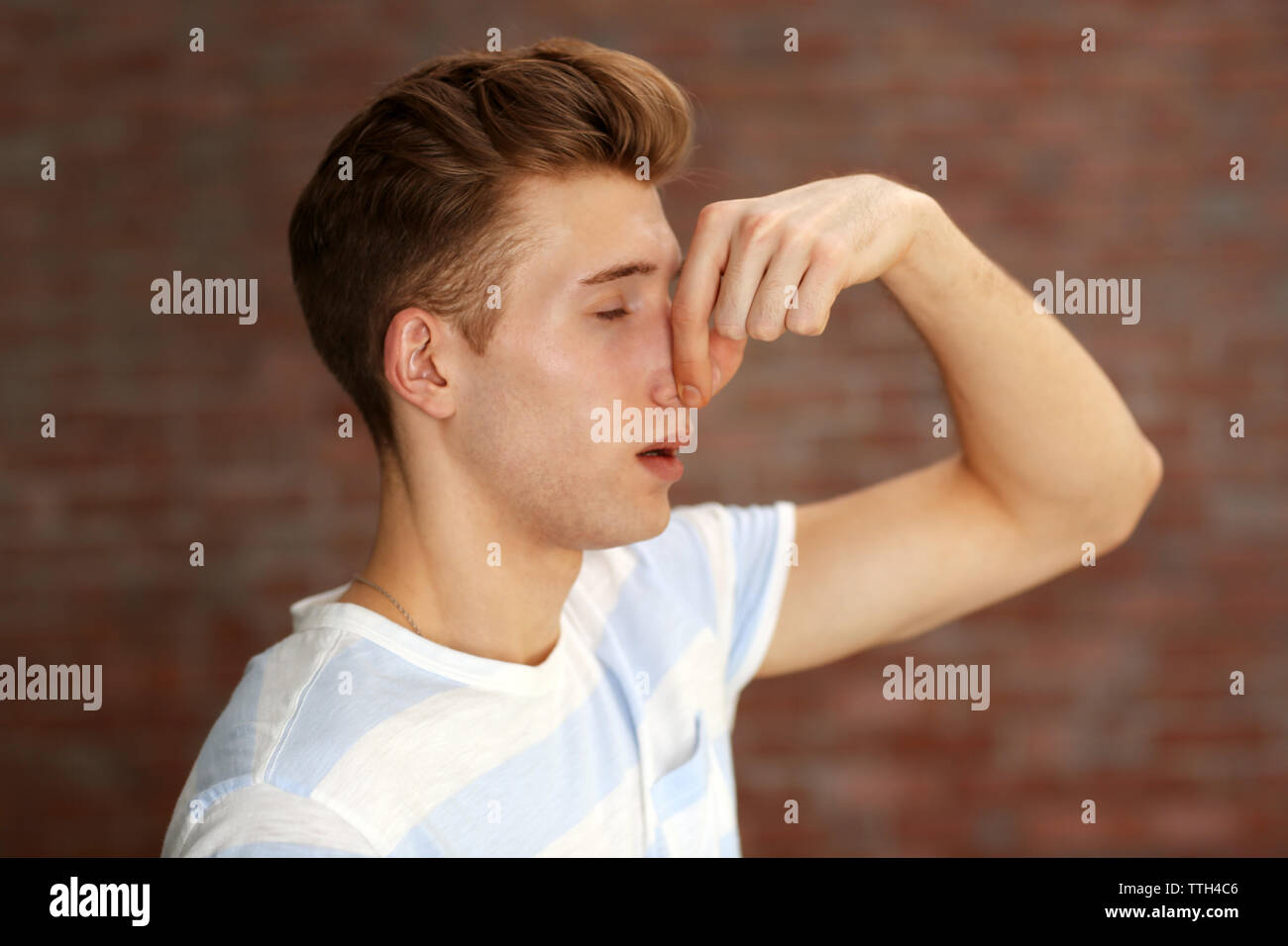 Boy pinching nose hi-res stock photography and images - Alamy