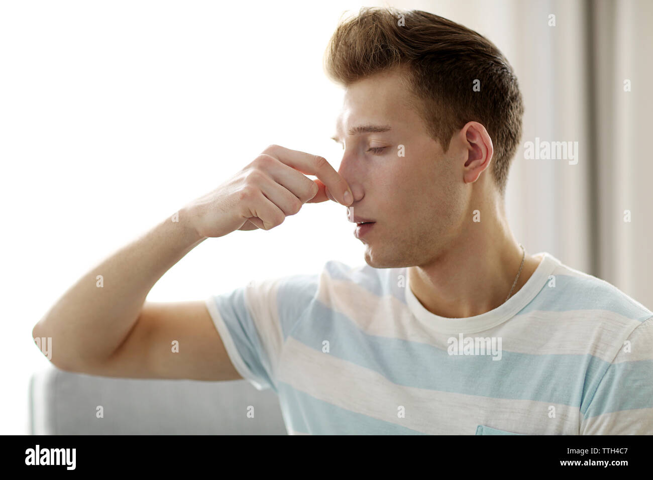 Hand pinching nose hi-res stock photography and images - Alamy