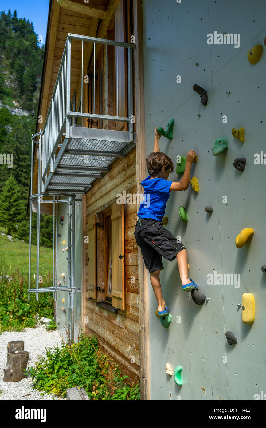 Boy climbing wall nature hi-res stock photography and images - Alamy