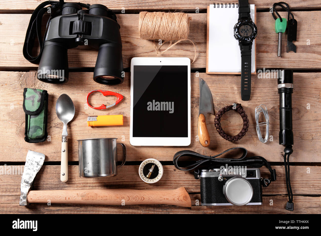 Tourism concept. Explorer equipment on wooden background, top view ...