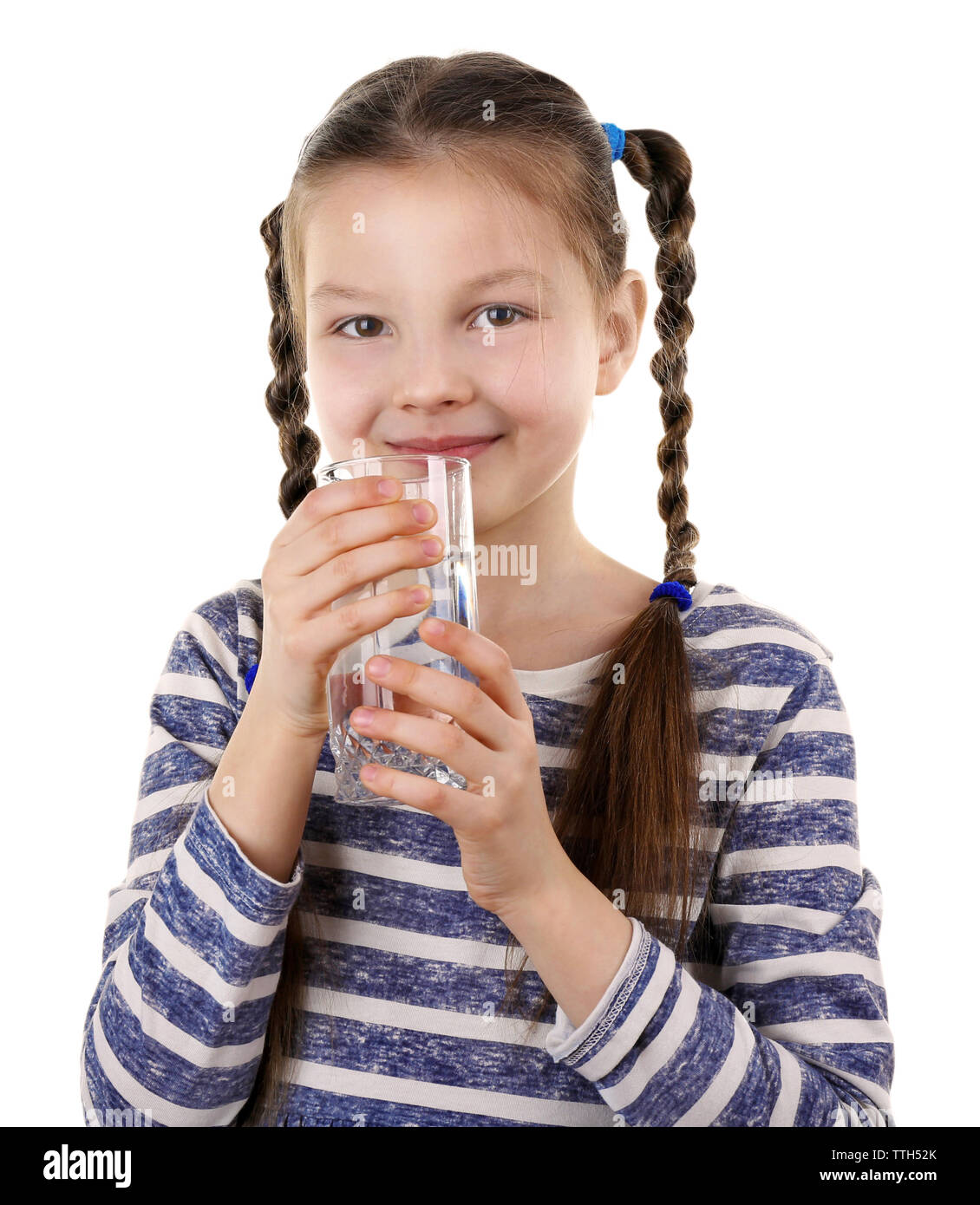 Cute girl drinking water isolated on white Stock Photo - Alamy