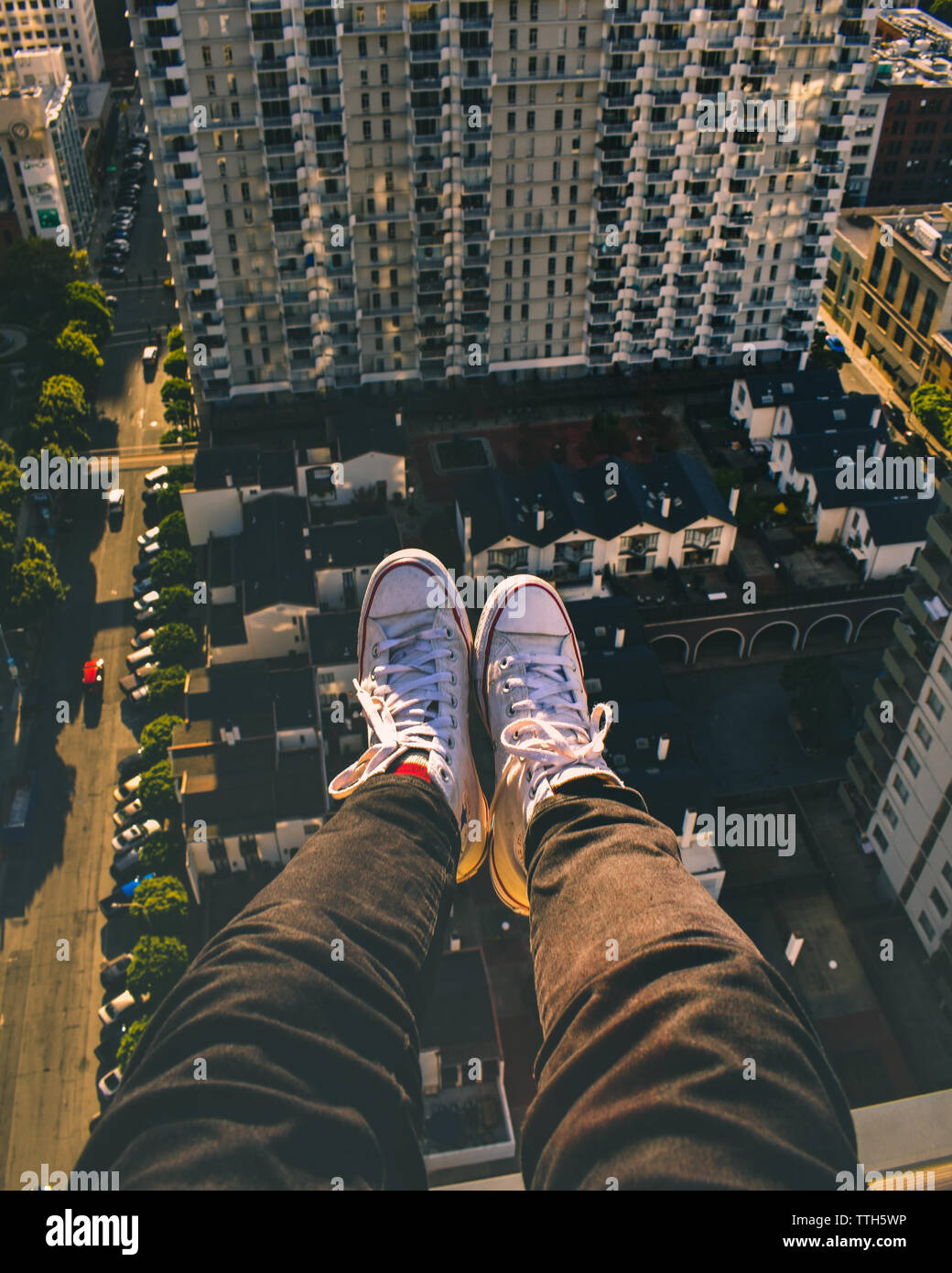 Feet Dangling From Above city from rooftop Stock Photo - Alamy