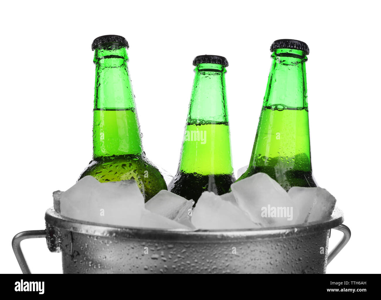 Beer bottles in ice bucket, isolated on white Stock Photo - Alamy