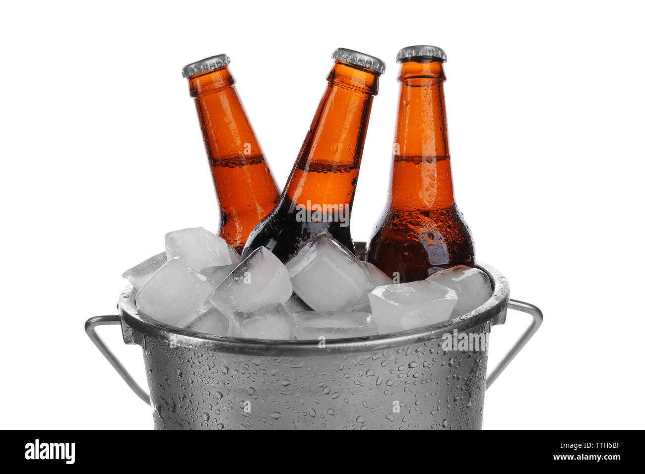 Beer bottles in ice bucket, isolated on white Stock Photo - Alamy