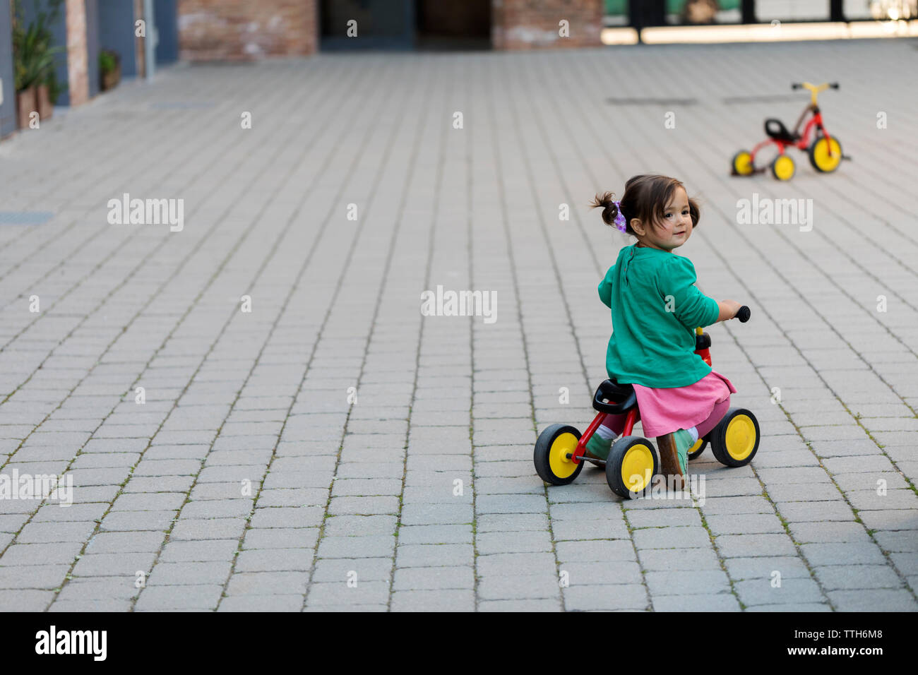Toddler on tricycle hi-res stock photography and images - Alamy
