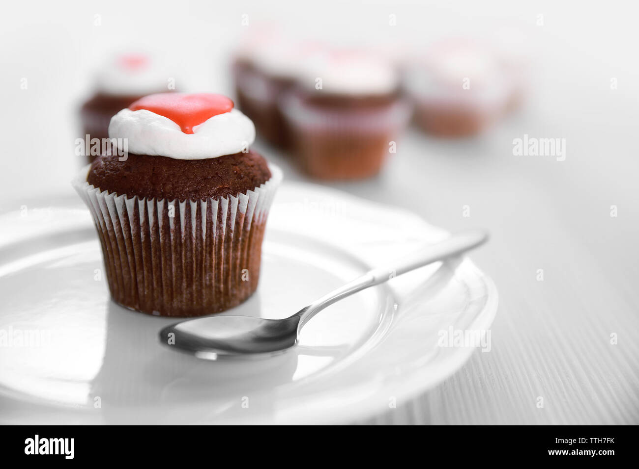 Cupcake on plate, closeup Stock Photo - Alamy