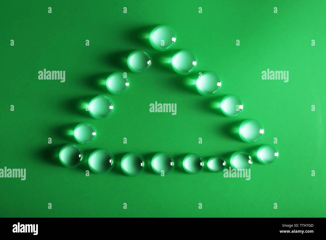 Water drops on a green surface, top view Stock Photo - Alamy