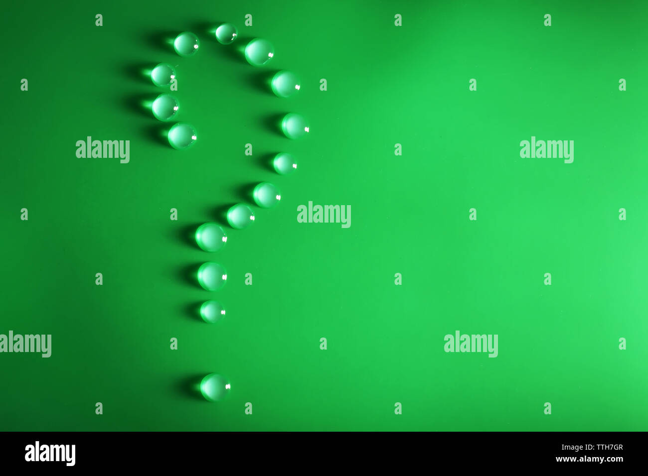 Water drops on a green surface, top view Stock Photo - Alamy