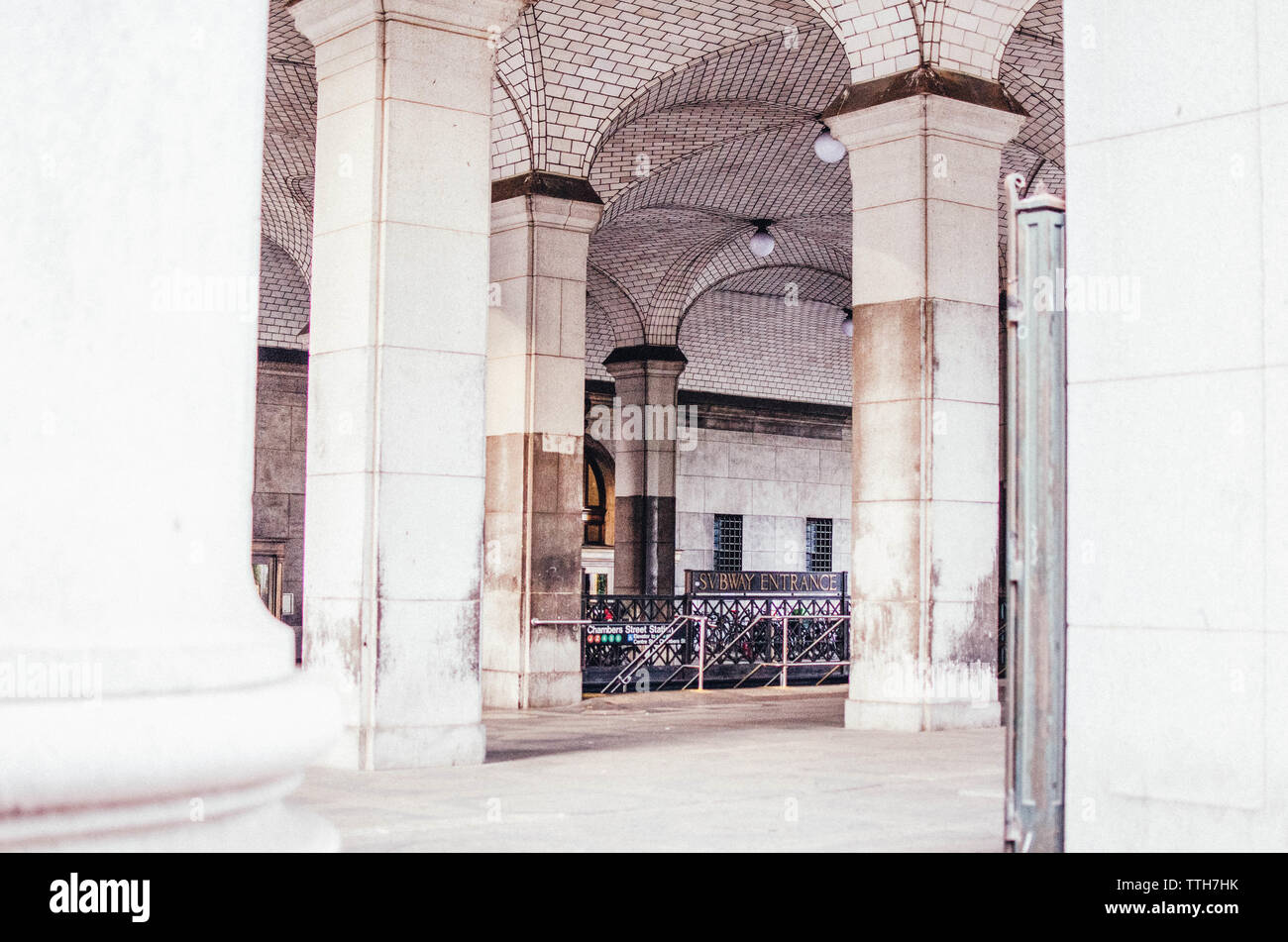 Subway entrance with white columns and curved tiled ceilings Stock ...