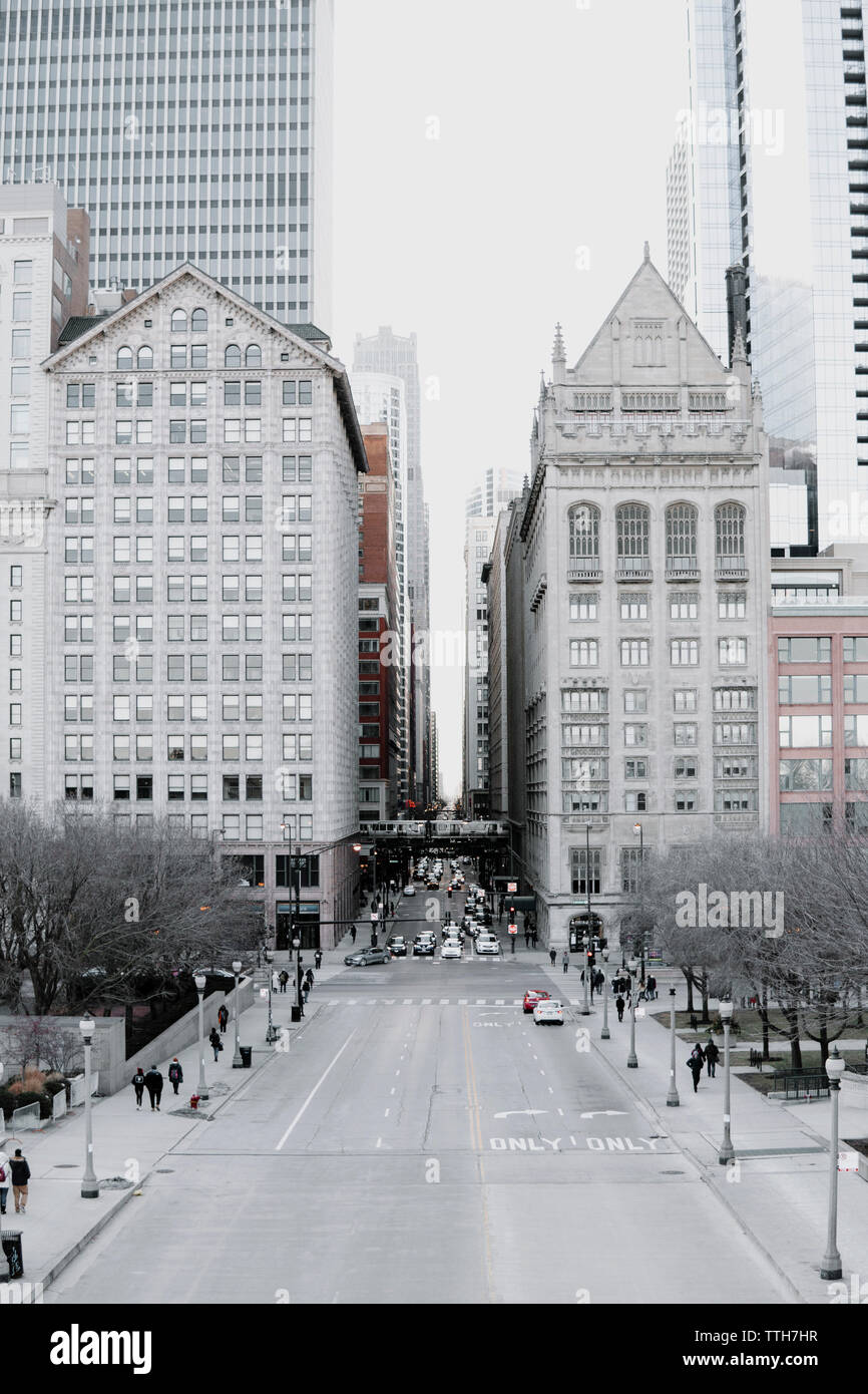 Urban city street with historical buildings and skyscrapers Stock Photo ...